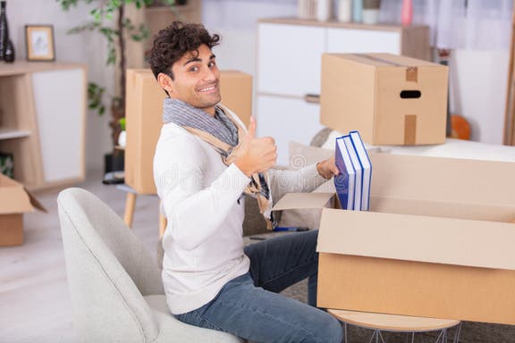 Man Packing Books into Cardboard Box Stock Image - Image of estate ...