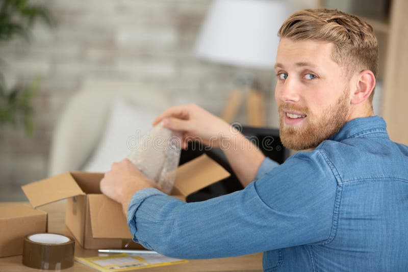 Man packing box stock image. Image of retail, unpacking - 260339685
