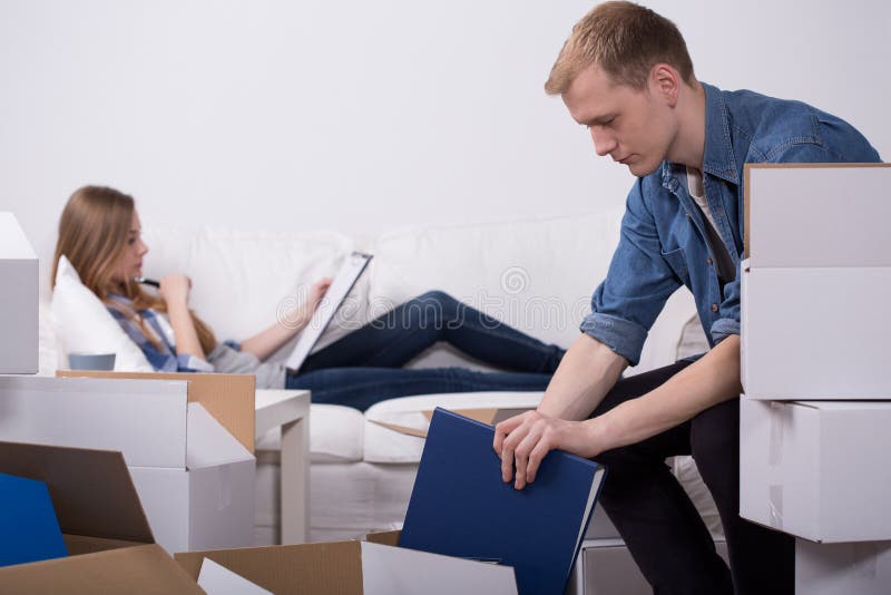 Man packing boxes stock image. Image of moving, flat - 54330315