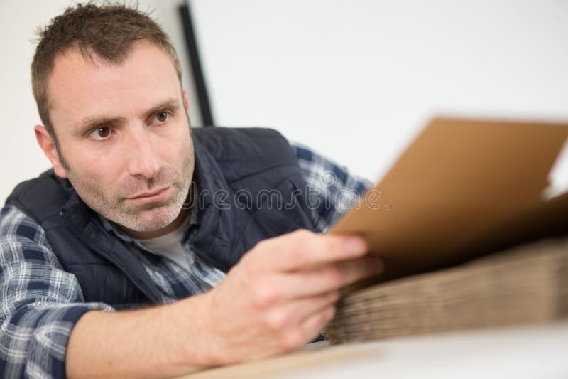 Man packing card box stock image. Image of taking, auto - 294500743