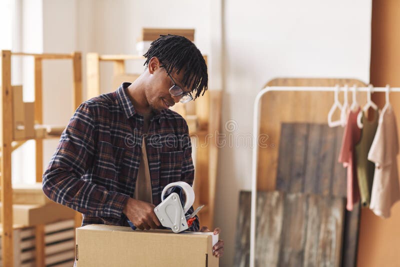 Man Packing Parcel in Warehouse Stock Photo - Image of packaging ...