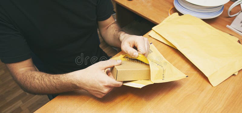 Packing the Product into the Yellow Envelope Stock Image - Image of ...