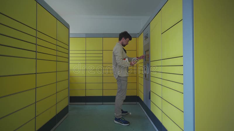 Man at Packing Station Using Screen and Holding Box for Self Shipment ...