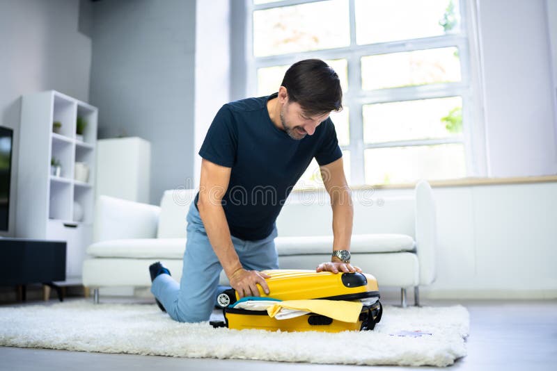Man Packing Stuffed Suitcase Bag Stock Image - Image of apartment ...