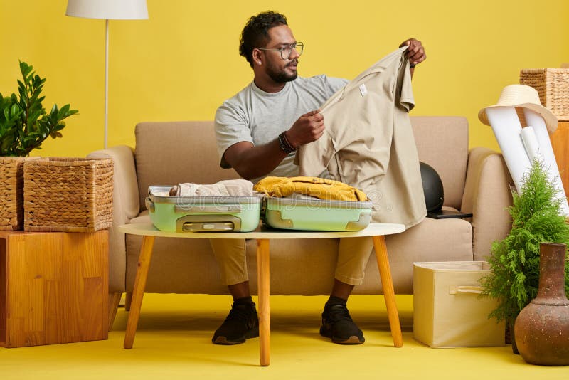 Man Packing Suitcase stock image. Image of unpacking - 261399461