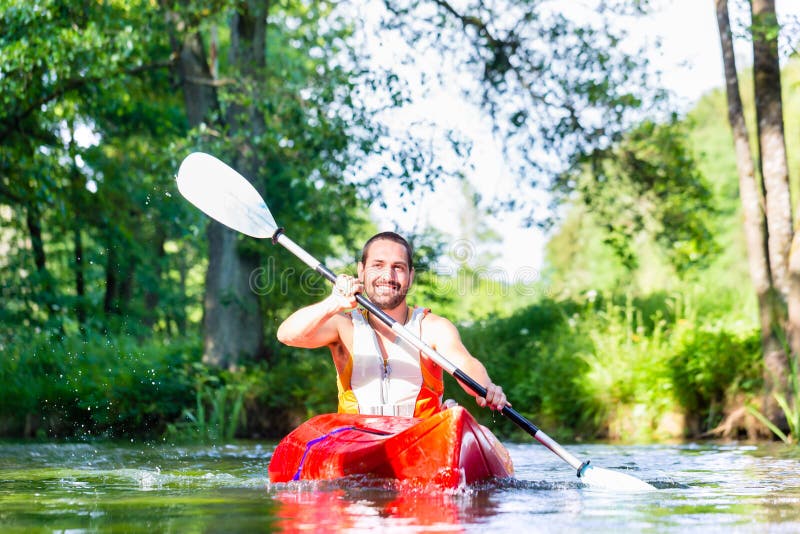 Man Paddling with Canoe on Forest River Stock Image - Image of ...