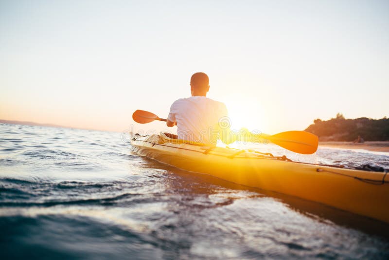 Man paddling the kayak stock photo. Image of motion - 169380914