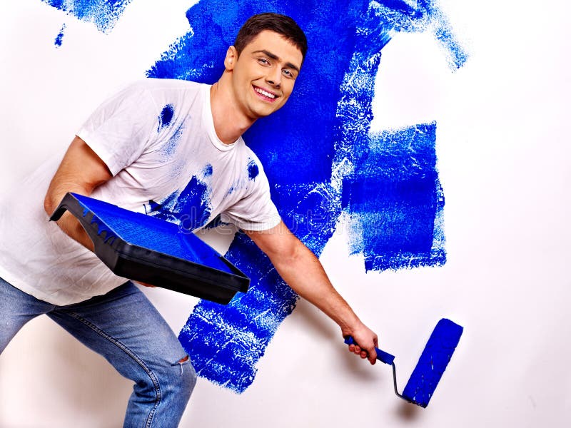 Man paint wall at home. stock photo. Image of interior - 45149164