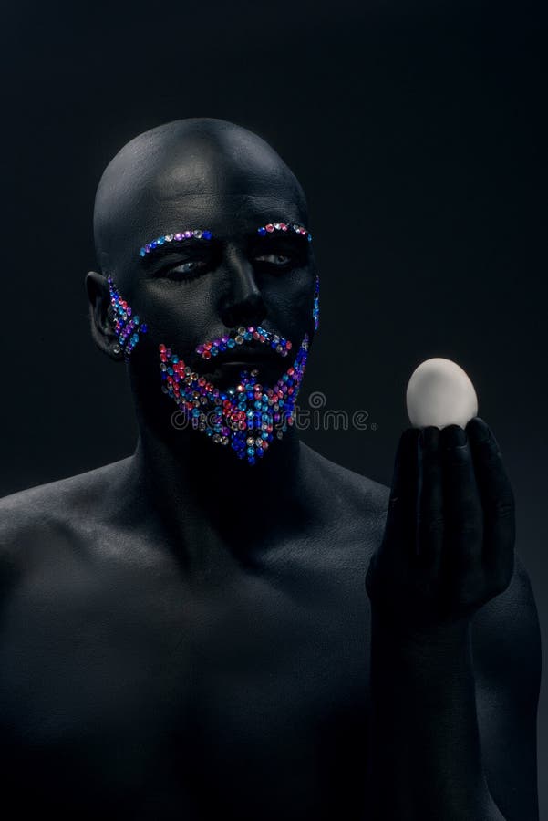 Man Painted in Blue Color with Snowy Hair and Beard Eating Tomato Stock ...