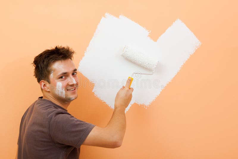 Man painting a wall stock image. Image of brown, copy - 12526405