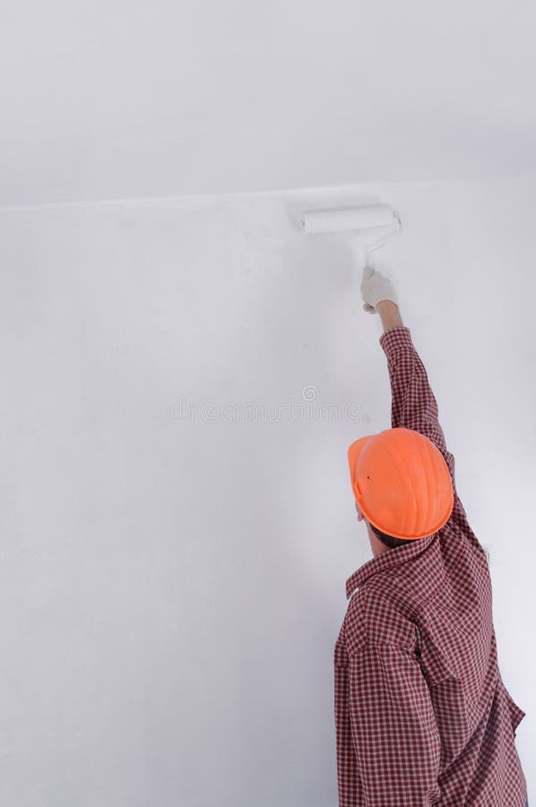 Painting a wall stock photo. Image of adult, construction - 106124014