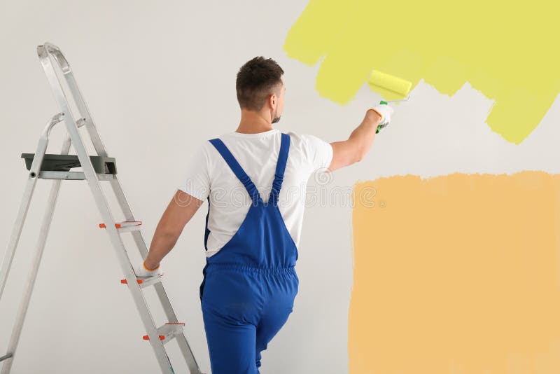 Man Painting Wall with Yellow Dye Indoors, Back View Stock Image ...