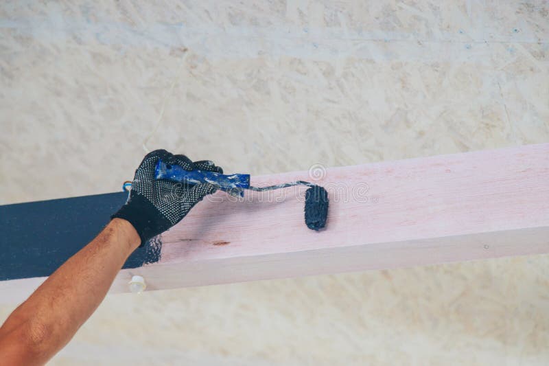 Man Painting a Wooden Beam. Selective Focus Stock Photo - Image of ...