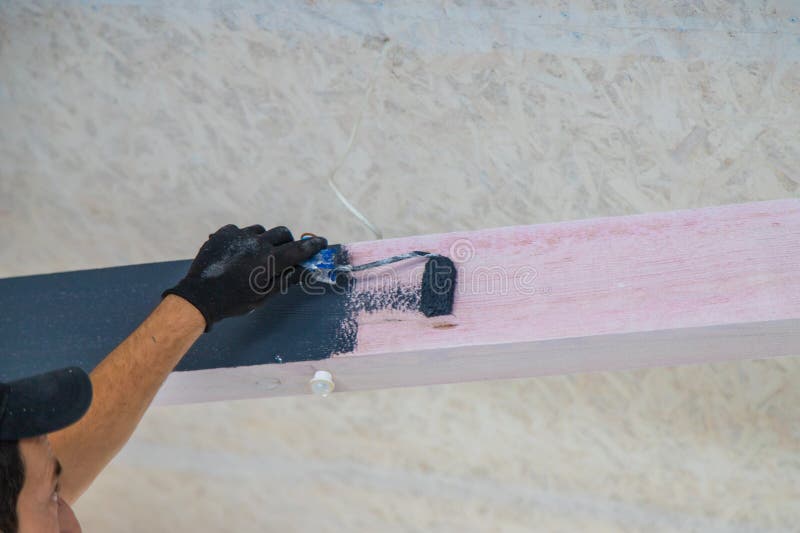 Man Painting a Wooden Beam. Selective Focus Stock Image - Image of ...