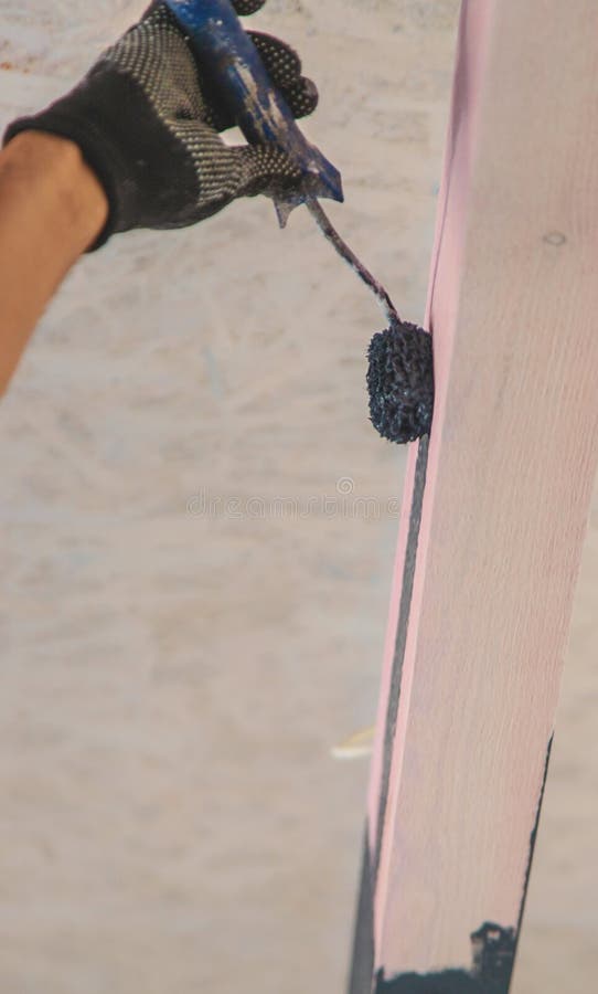 Man Painting a Wooden Beam. Selective Focus Stock Image - Image of ...