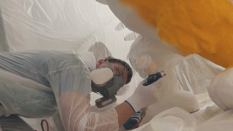 The Man Paints a Voluminous Figure Made of Expanded Polystyrene Stock ...