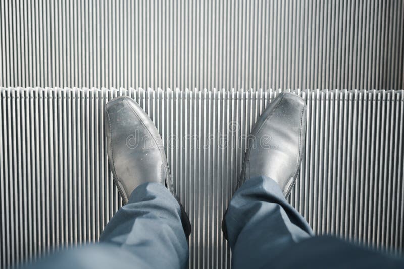 Man with Pair of Leather Shoes Standing on Move Up Escalator Stock ...