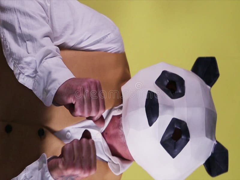 Man with Panda Mask Dancing Happily Isolated on a Yellow Background ...