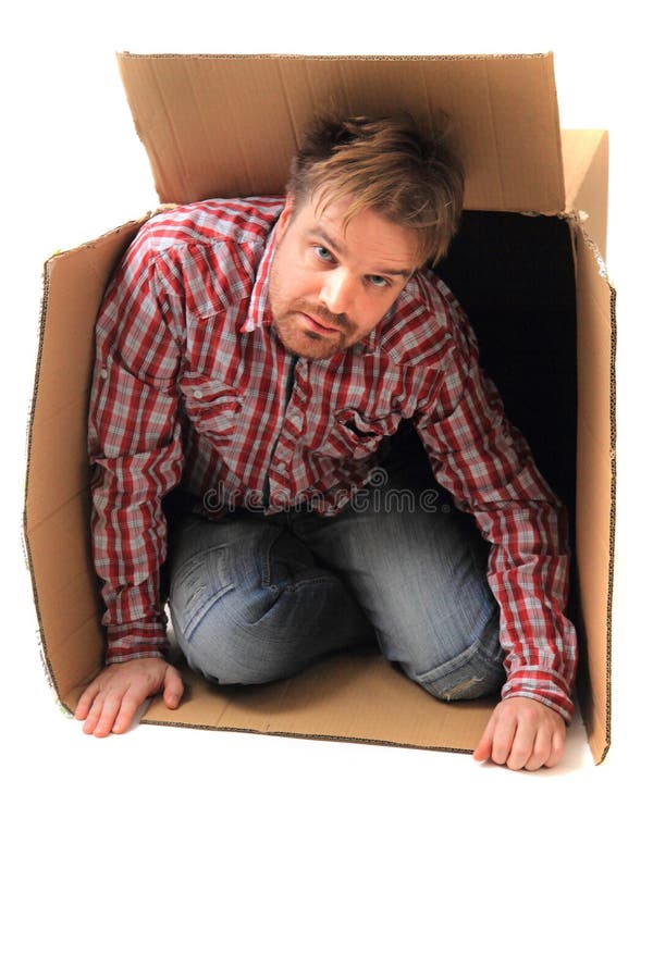 Young Man is Pressuring on Walls Inside Cardboard Box Stock Image ...