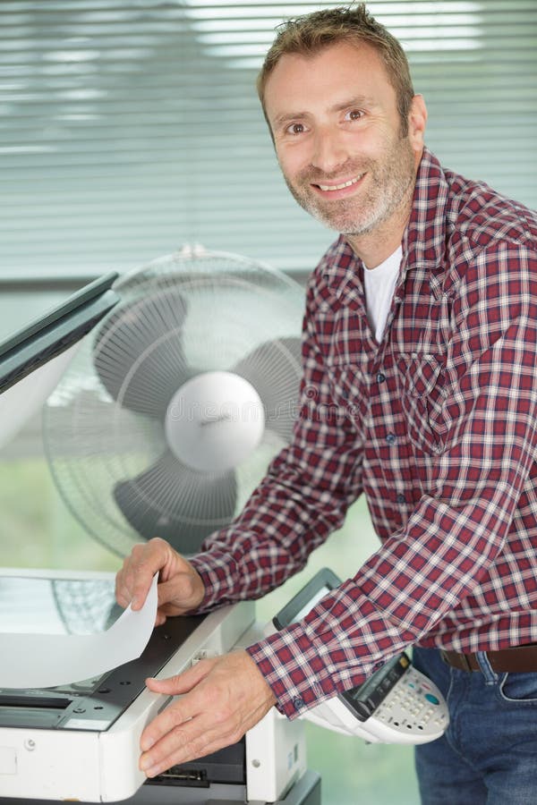 Man with Paper Sheet from Printer Stock Photo - Image of computer ...