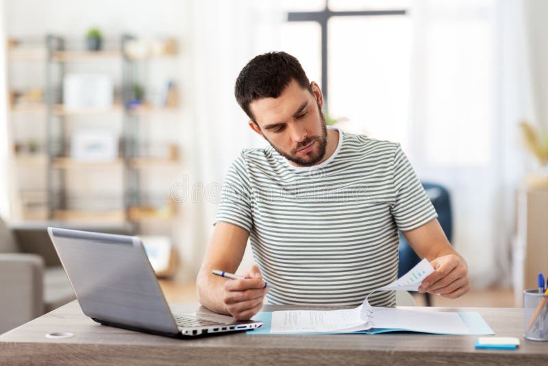 Man with Papers and Laptop Working at Home Office Stock Image - Image ...