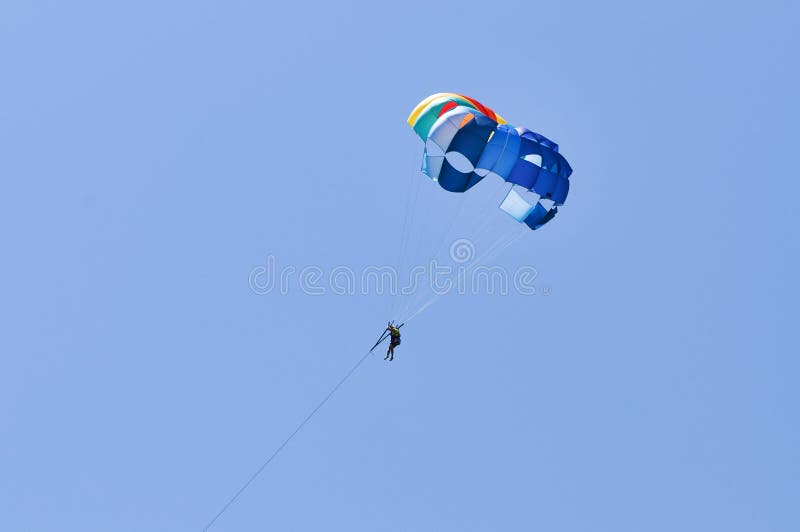 Man with parachute stock photo. Image of diving, blue - 10942198
