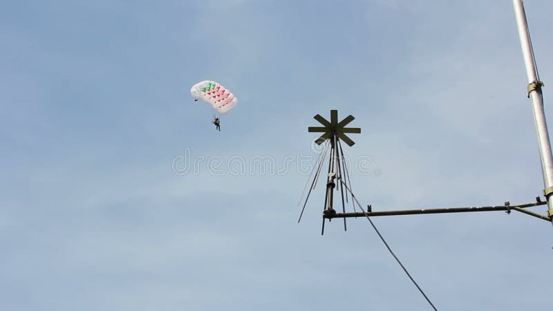 A Man Parachutes Down To the Ground. Parachute Flight Stock Video ...