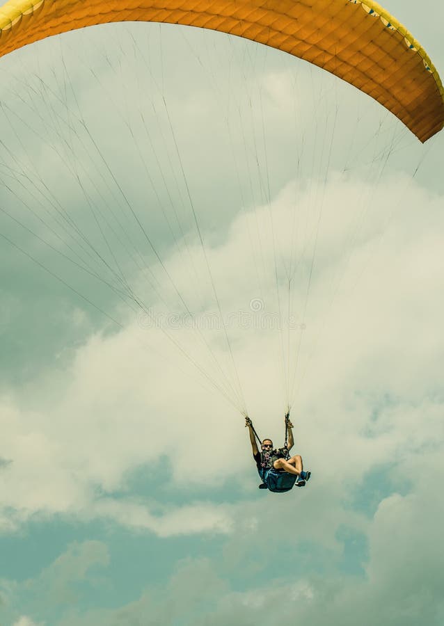 A man paragliding stock image. Image of paragliding - 121534121