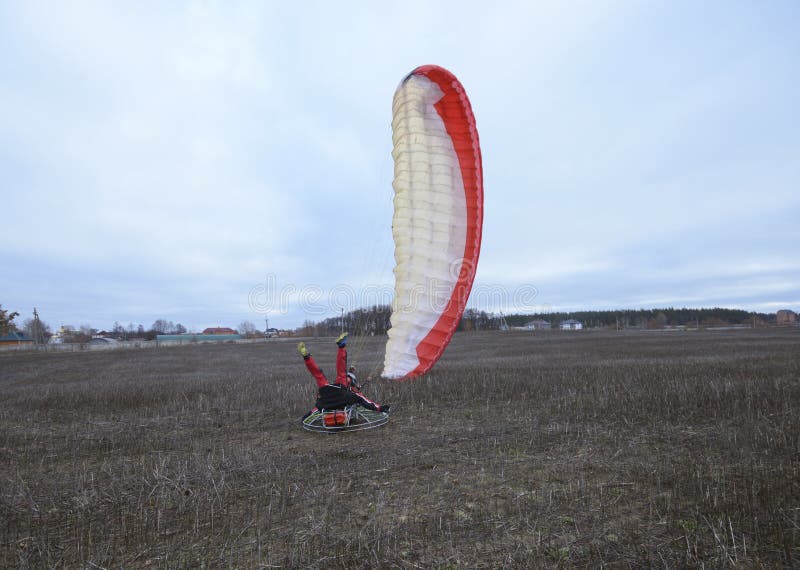 Man Paramotorist and Paramotor Falling Down on the Ground in the Field ...