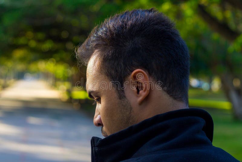 Man in a park looking back stock image. Image of face - 86130119