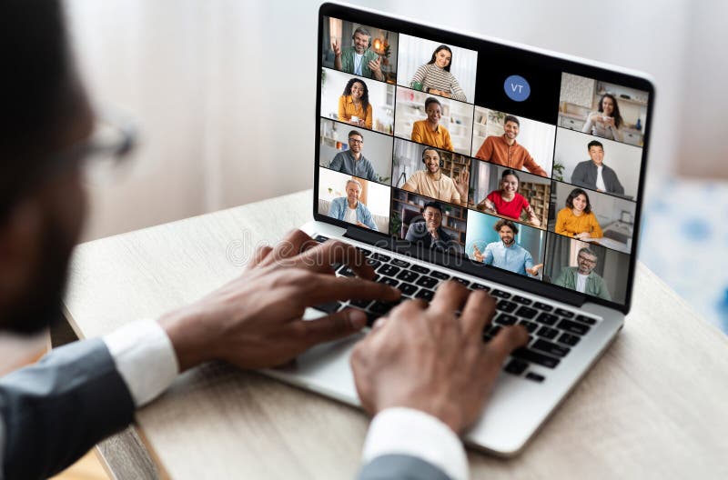 Man Participating in Video Conference with Multiple Participants on ...