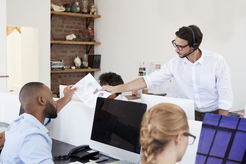 Man Passing Document in Busy Open Plan Office, Close Up Stock Image ...