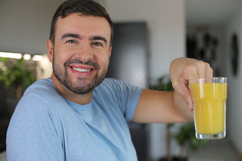 Man Passing a Drink To Someone with the Fingers Inside the Beverage ...