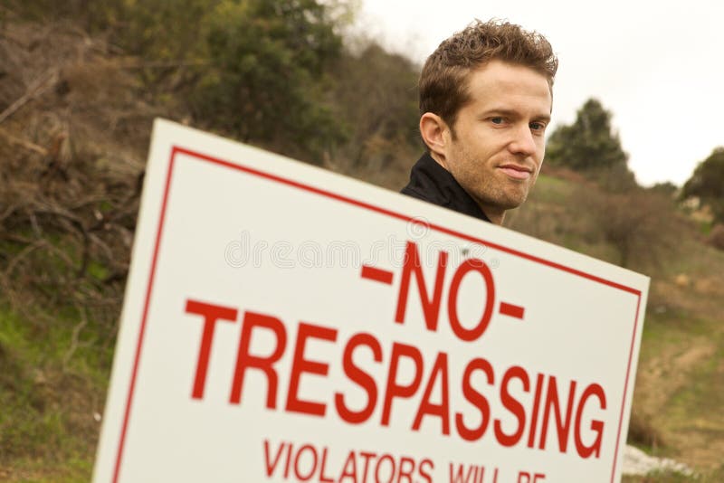 A Man Passing No Trespassing Sign Stock Image - Image of horizontal ...