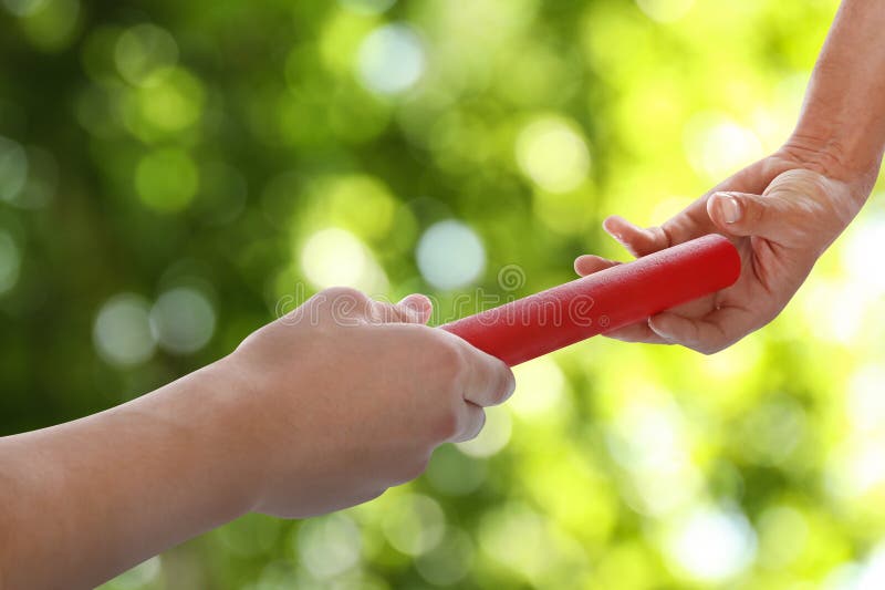 Man Passing Relay Baton To Teammate Outdoors, Closeup Stock Image ...