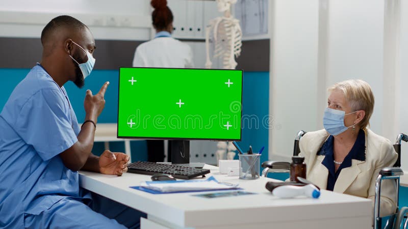 Man and Patient with Impairment Using Computer with Greenscreen Stock ...