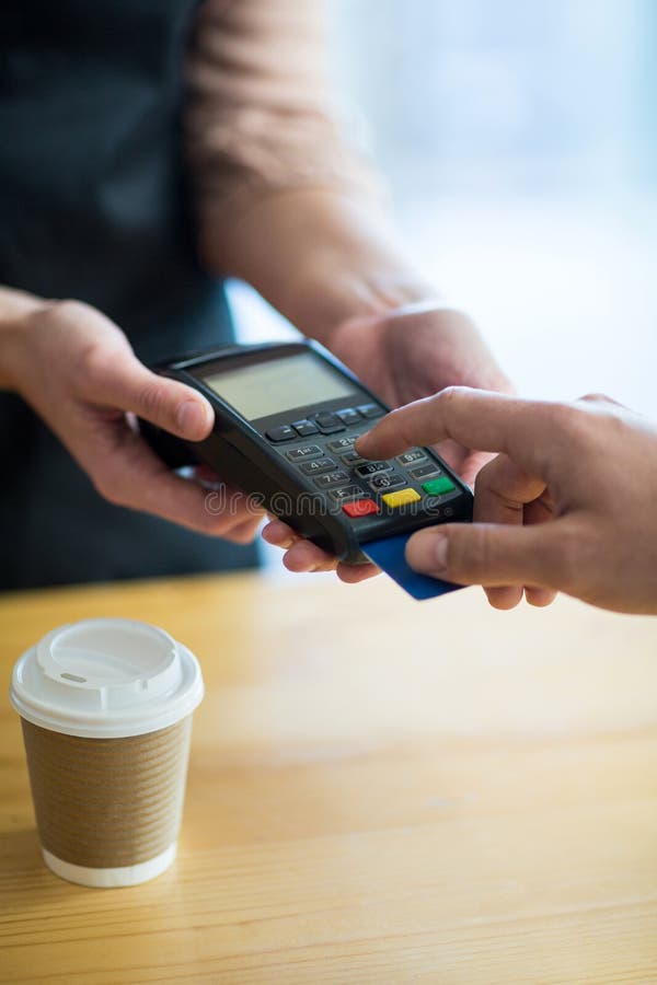 Man Paying Bill through Payment Terminal Stock Image - Image of hand ...