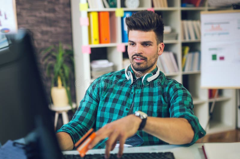 Man Paying with Credit Card on Computer at Office Stock Photo - Image ...