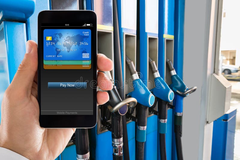 Paying for Gas - Happy stock photo. Image of pumps, charge - 998818