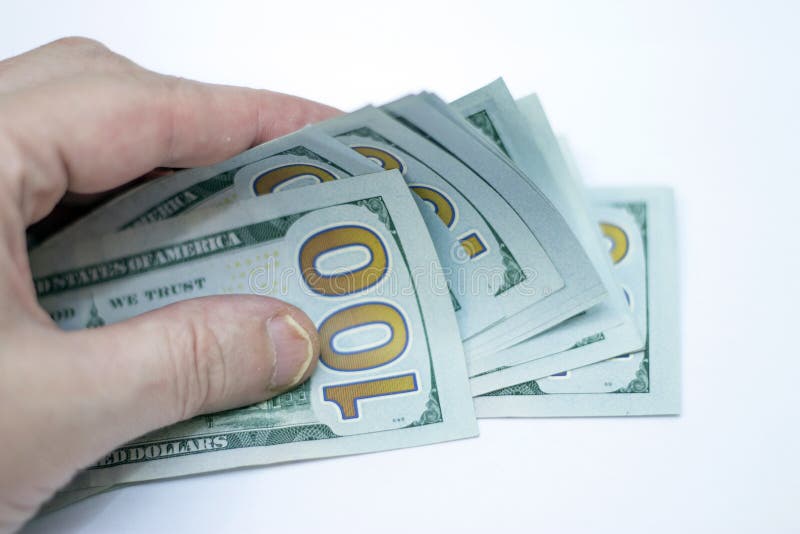 Man Paying by Stack of Paper Dollars Usa on the White Background Stock ...