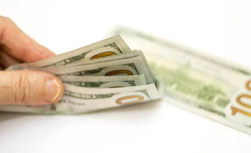 Man Paying by Stack of Paper Dollars Usa on the White Background Stock ...