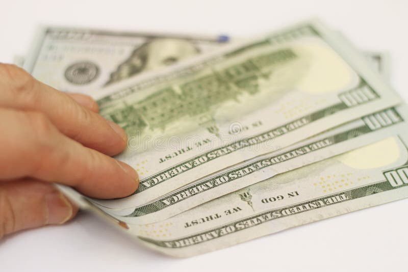 Man Paying by Stack of Paper Dollars Usa on the White Background Stock ...