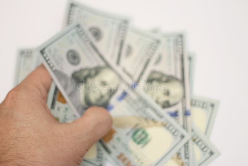 Man Paying by Stack of Paper Dollars Usa on the White Background Stock ...