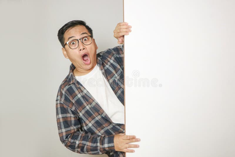 A Man Peeking Behind Wall Seeing Something with Confused Expression ...