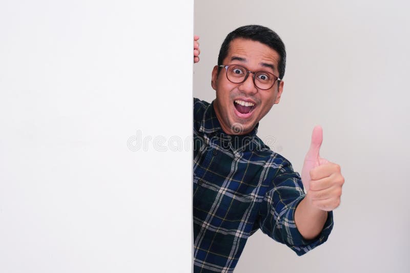 A Man Peeking Behind White Billboard with Excited Expression and Give ...