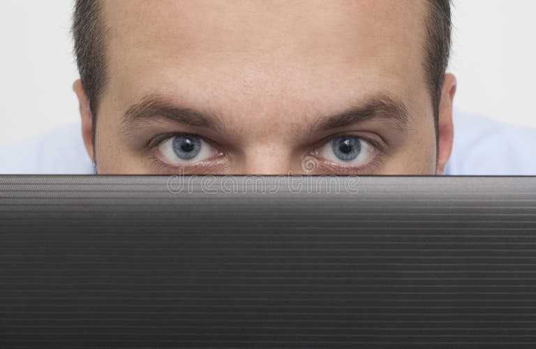 Man peeking over laptop stock image. Image of brown, laptop - 33971861