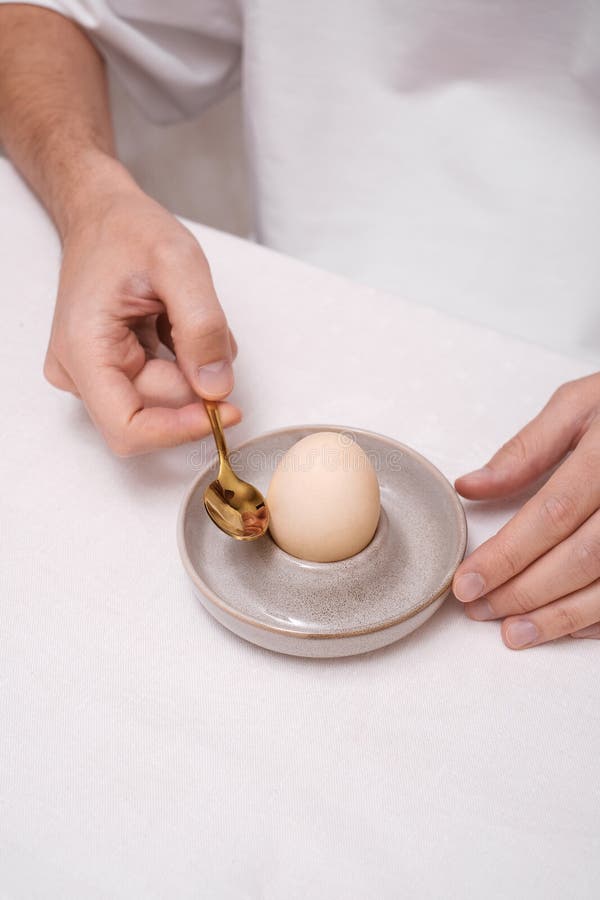 Man Peeling an Egg on a Stand Close-up of Hands Stock Image - Image of ...