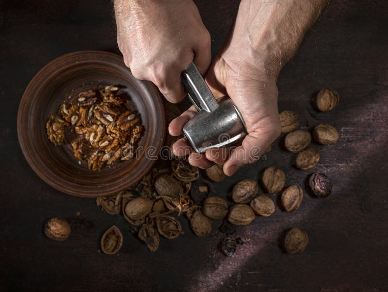 Man peeling nuts stock photo. Image of crack, tasty - 207528668