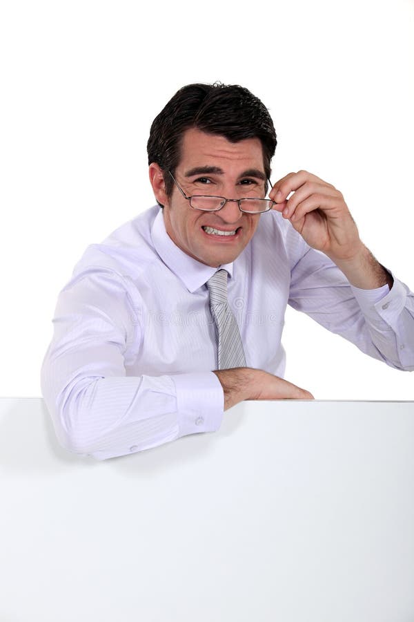 Man Peering Over His Glasses Stock Image - Image of perched, peer: 23549945