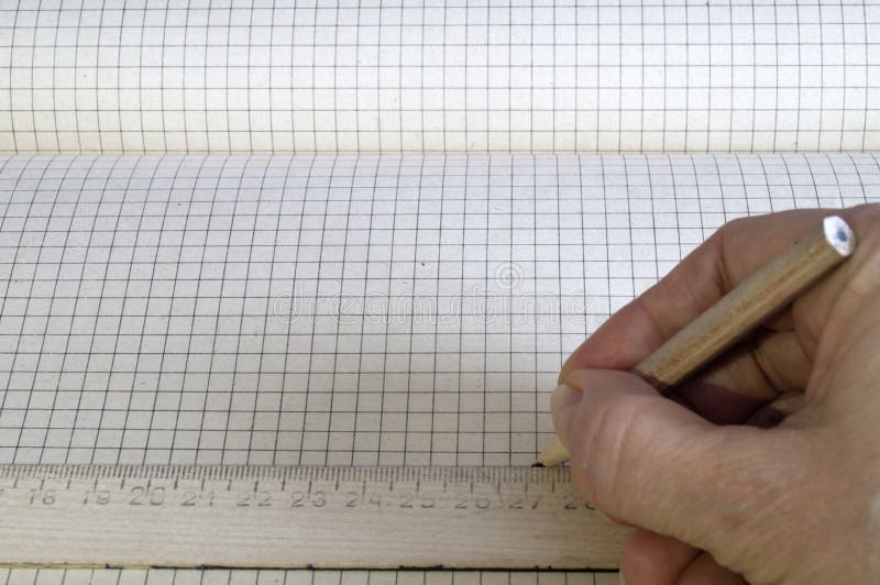 Pencil in Hand, Drawing a Ruler in a Notebook Stock Image - Image of ...